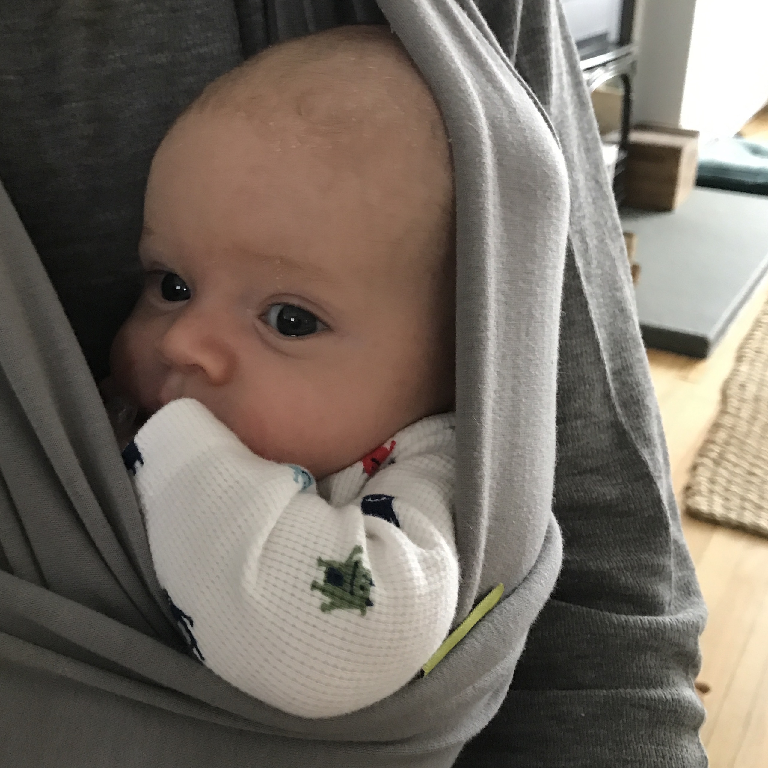 Declan loves lying on his playmat and looking at the animals ...